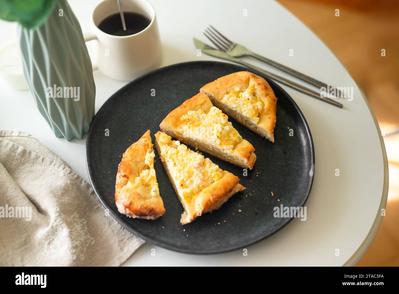 traditional Georgian cuisine. Open pie with mozzarella cheese. Ajara ...