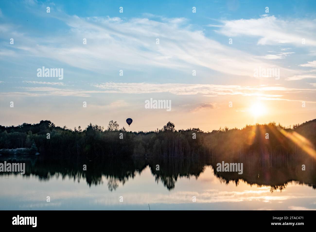 Captured at the moment when dawn breaks, this image presents a serene ...