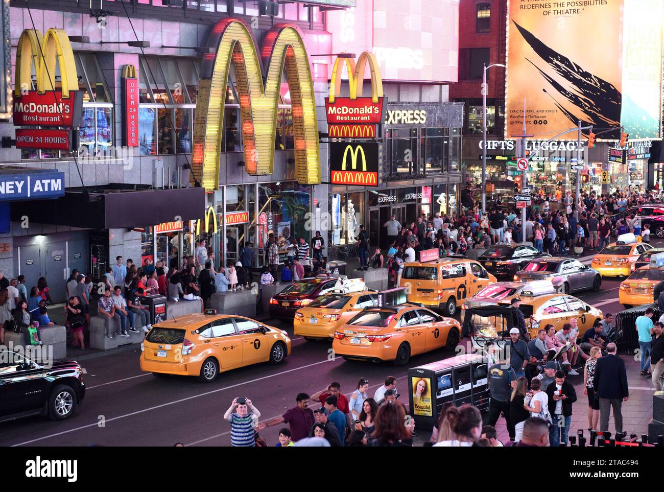 New York, USA - June 10, 2018: People and yellow taxis near the McDonalds at Times Square in New ...