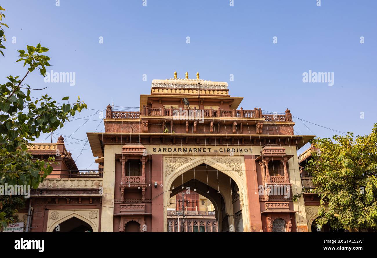 historic entrance gate with bright blue sky at day from unique angle ...