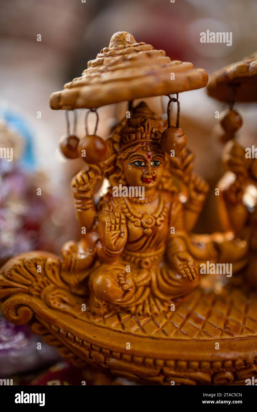 hindu god lakshmi idol clay made from flat angle Stock Photo - Alamy
