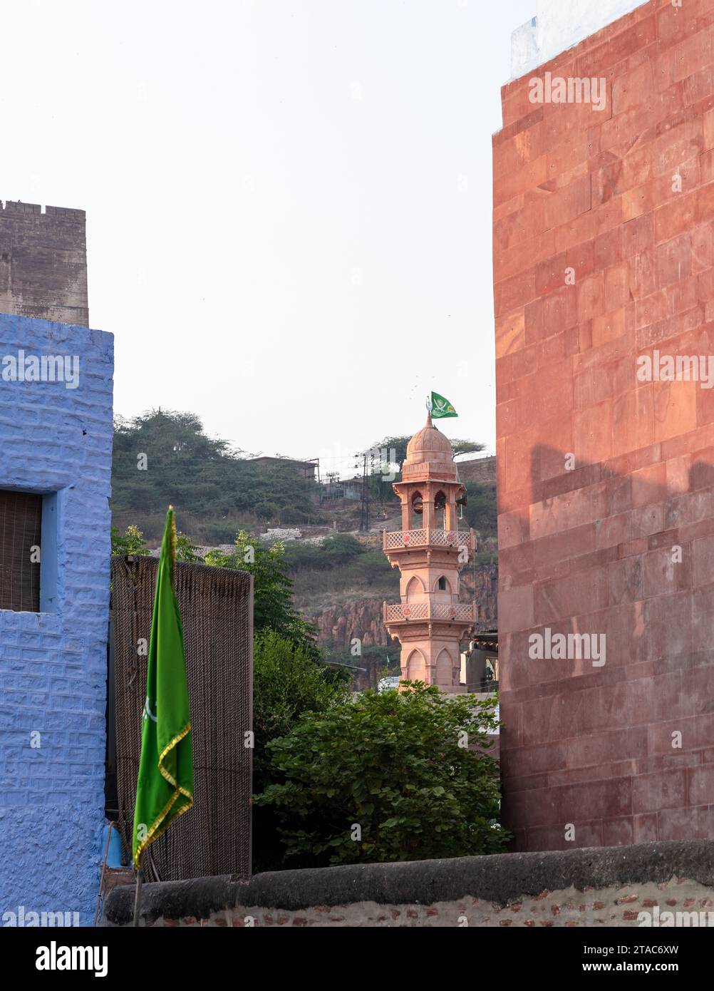 ancient mosque with waving religious flag at day from flat angle image ...