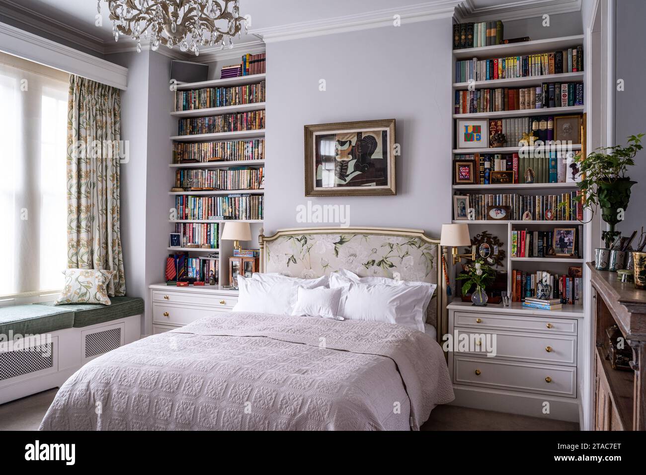 Extensive book and DVD collection with window seat in bedroom of late ...