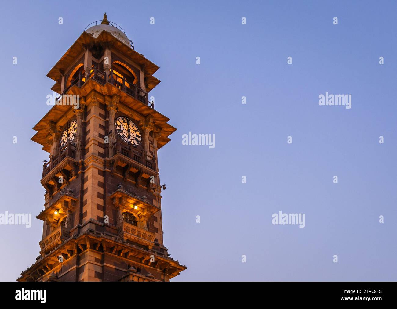 historical clock tower ancient architecture with bright blue sky at ...
