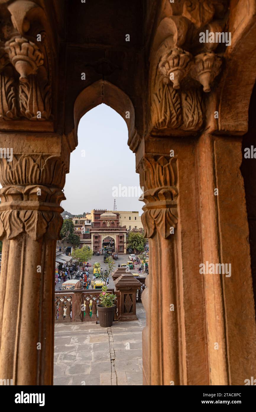 historic entrance gate with people shopping at street at day from ...