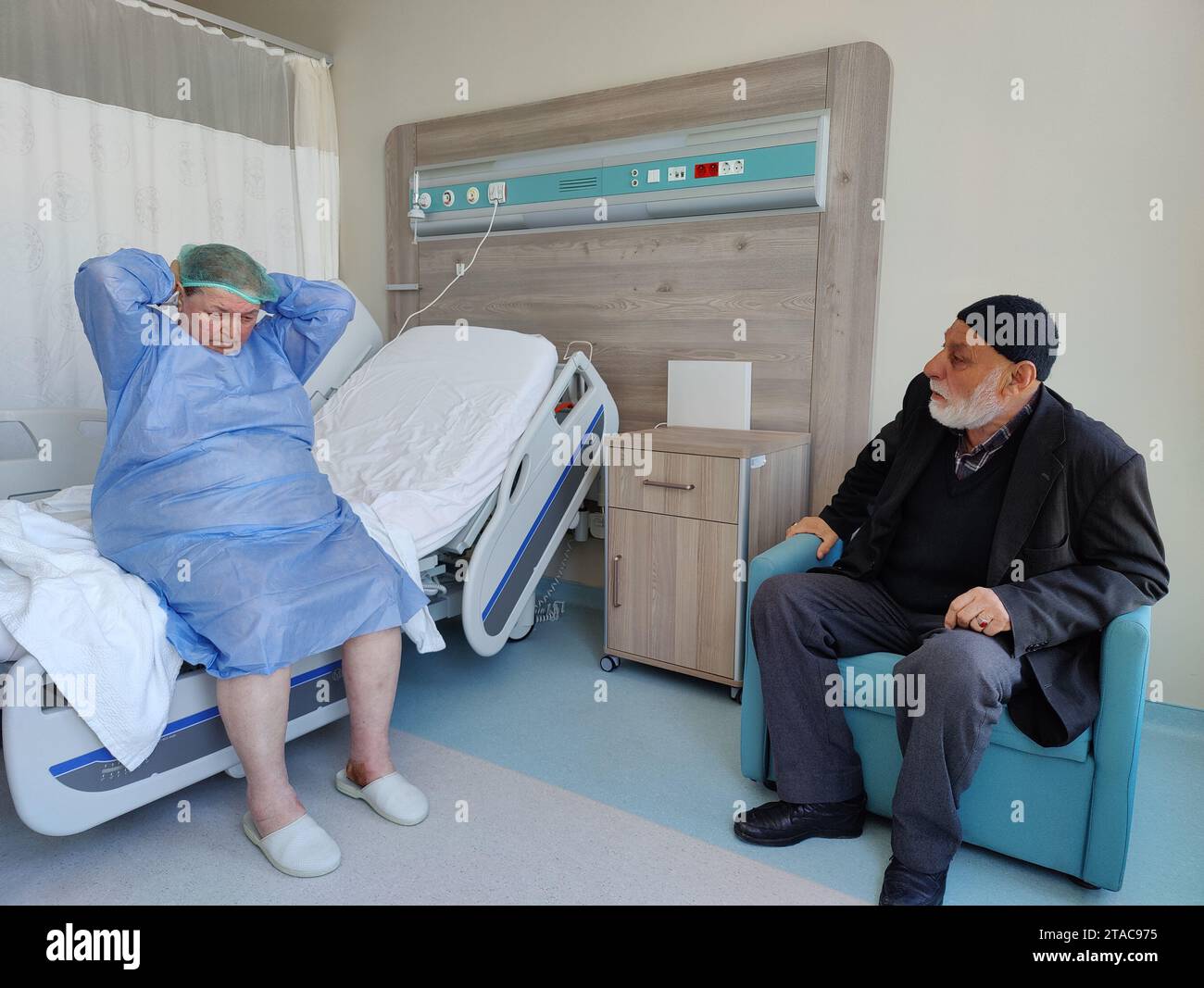 An elderly woman patient waiting for open heart surgery and her husband ...