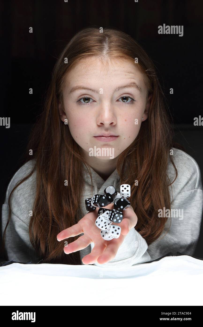 Girl rolls dice hi-res stock photography and images - Alamy