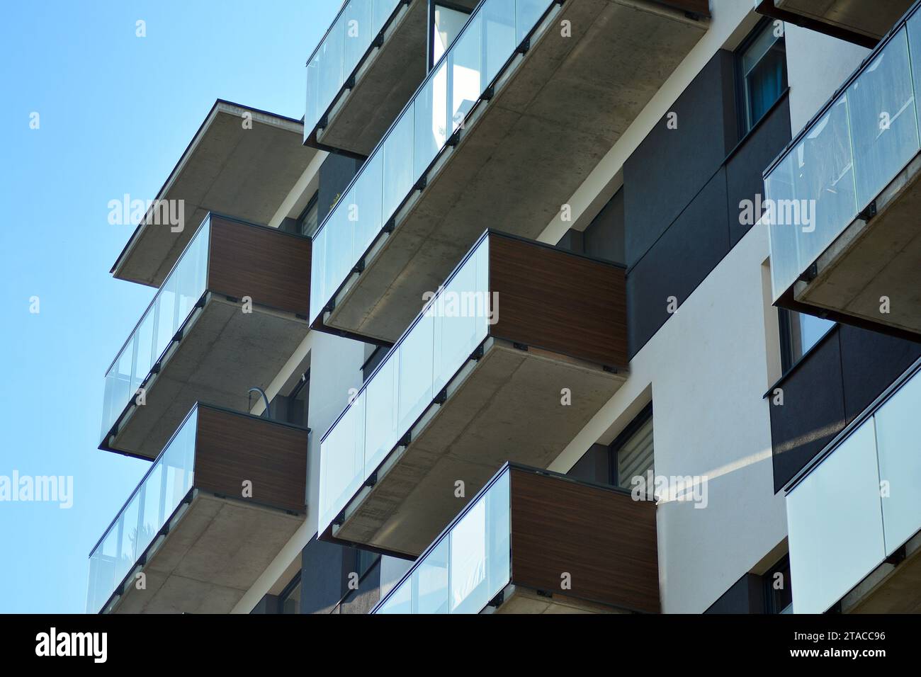 New apartment building with glass balconies. Modern architecture houses ...