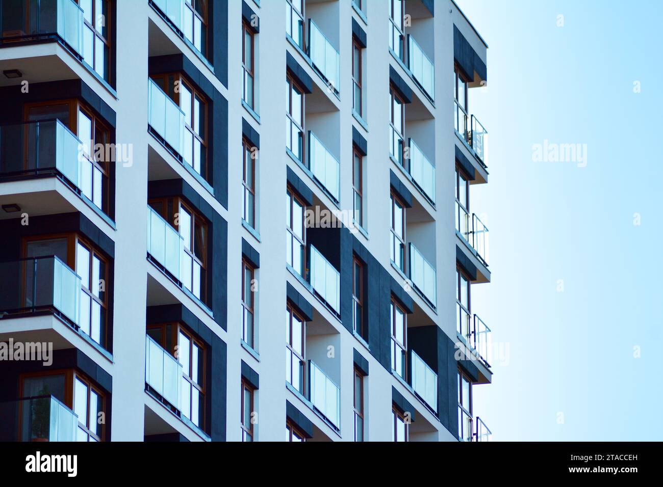 New apartment building with glass balconies. Modern architecture houses ...