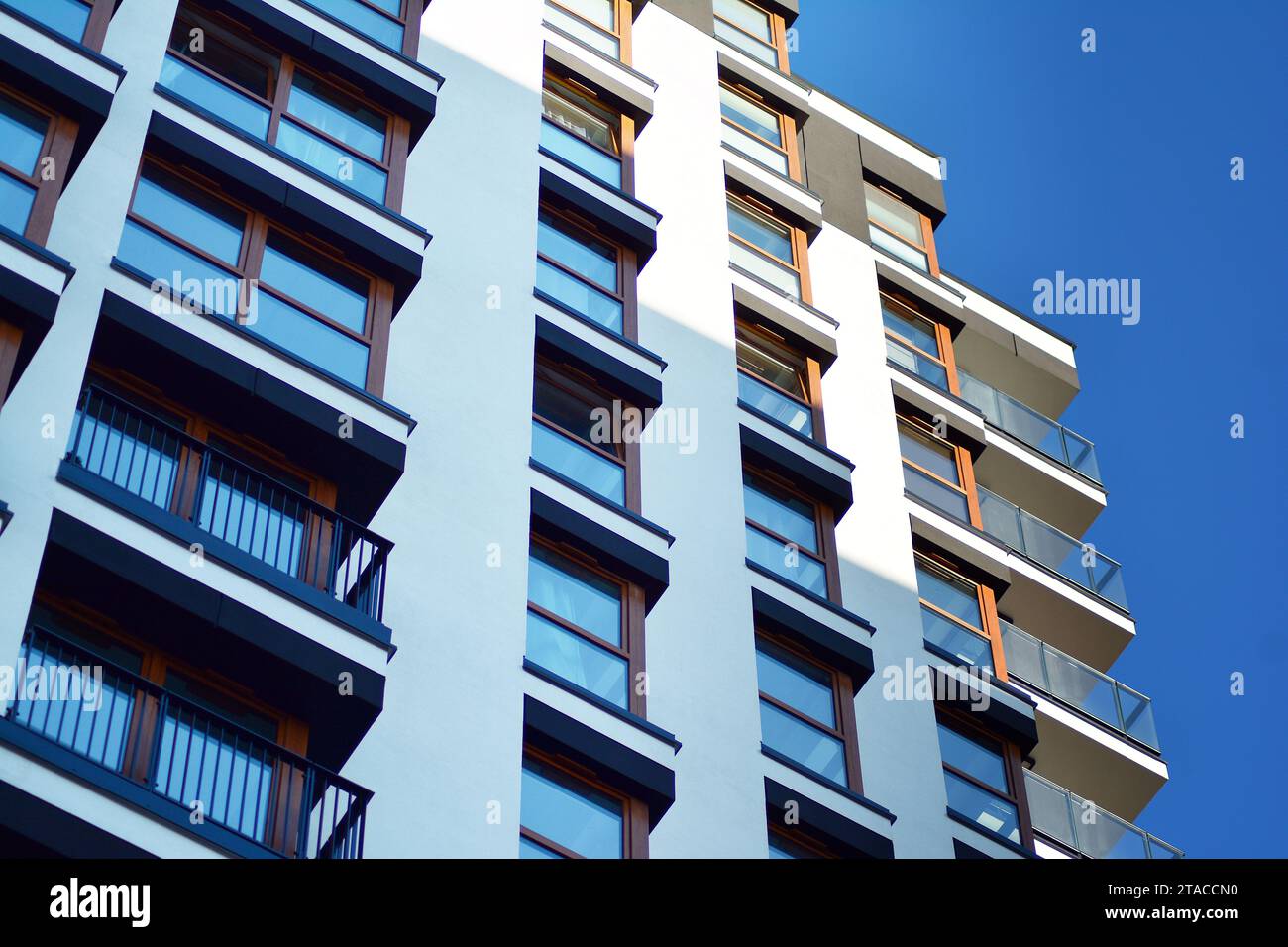 New apartment building with glass balconies. Modern architecture houses ...