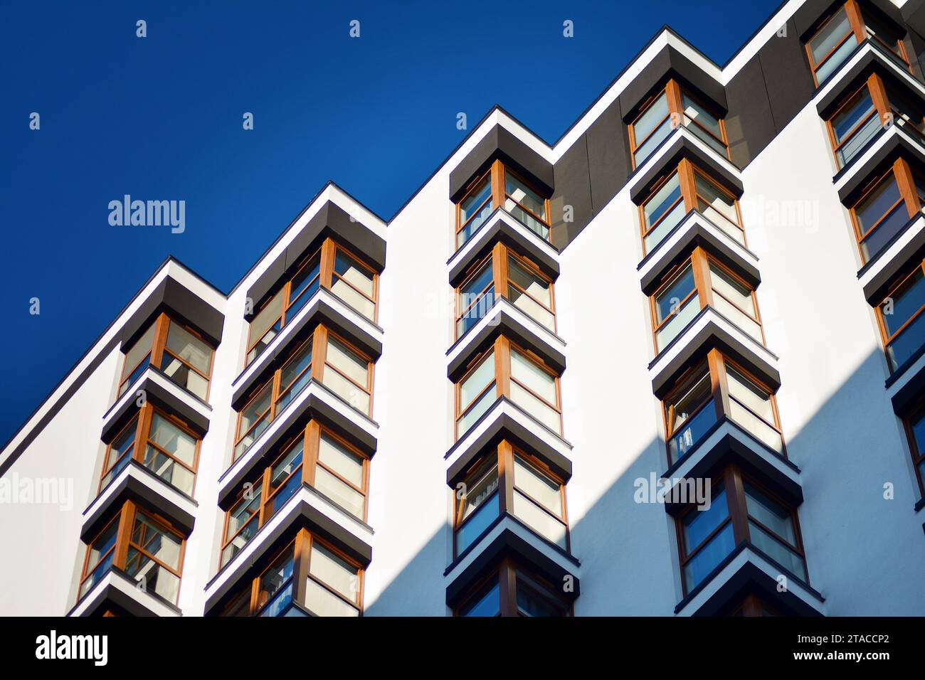 New apartment building with glass balconies. Modern architecture houses ...