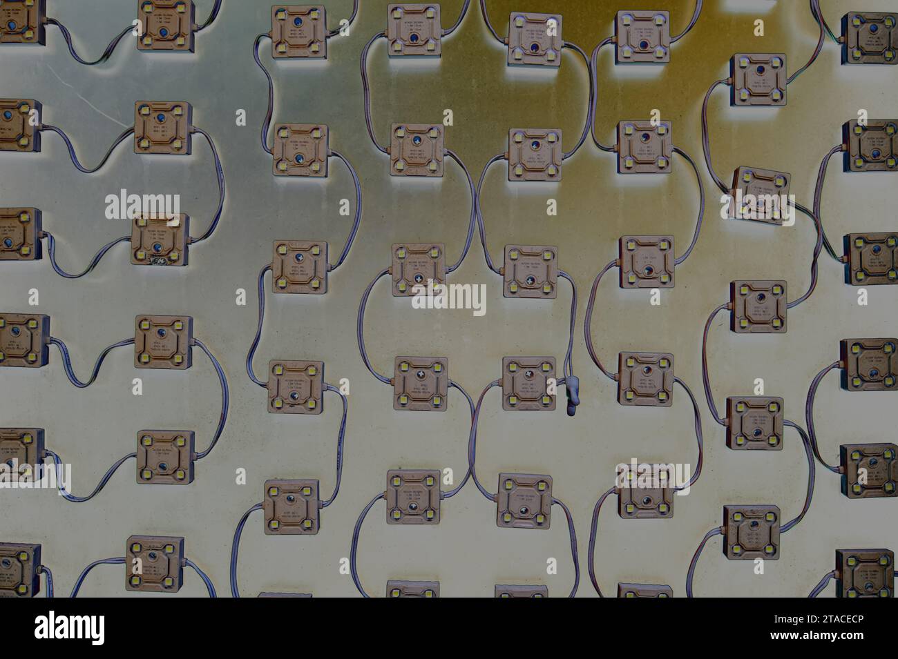 Backboard with junction boxes and wires in rows connected in a serial ...