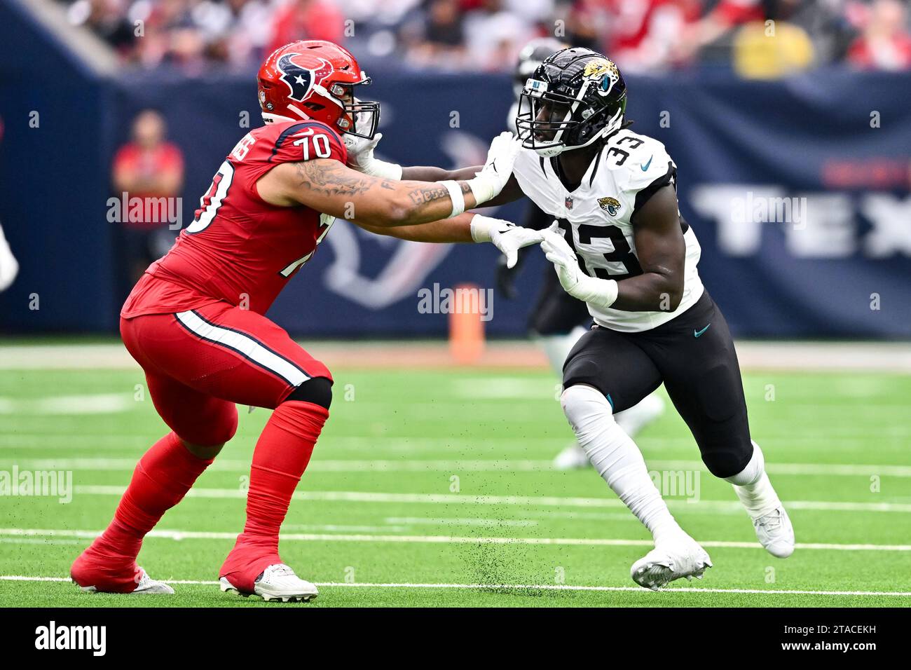 Jacksonville Jaguars linebacker Devin Lloyd (33) and Houston Texans ...