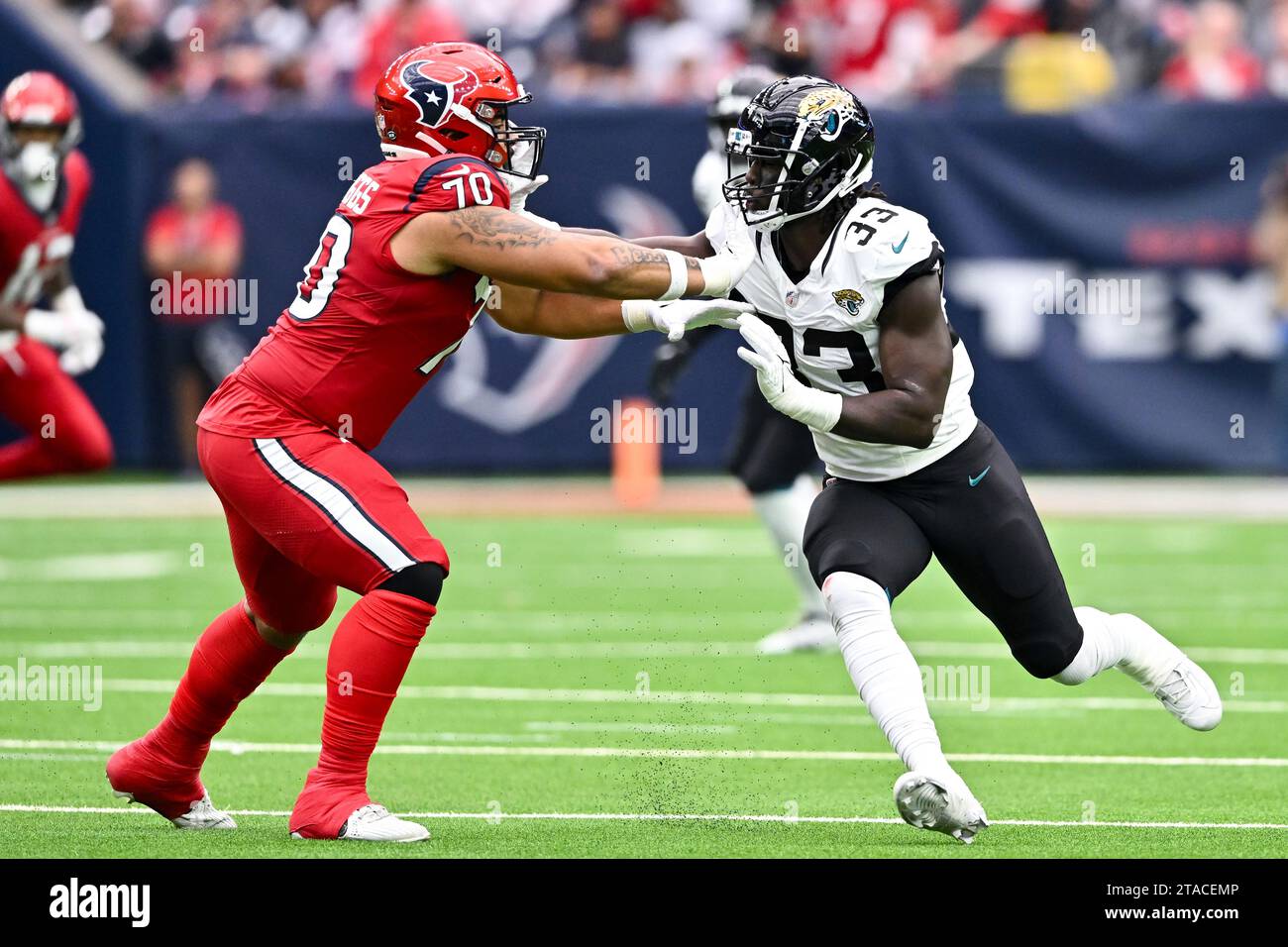 Jacksonville Jaguars linebacker Devin Lloyd (33) and Houston Texans ...