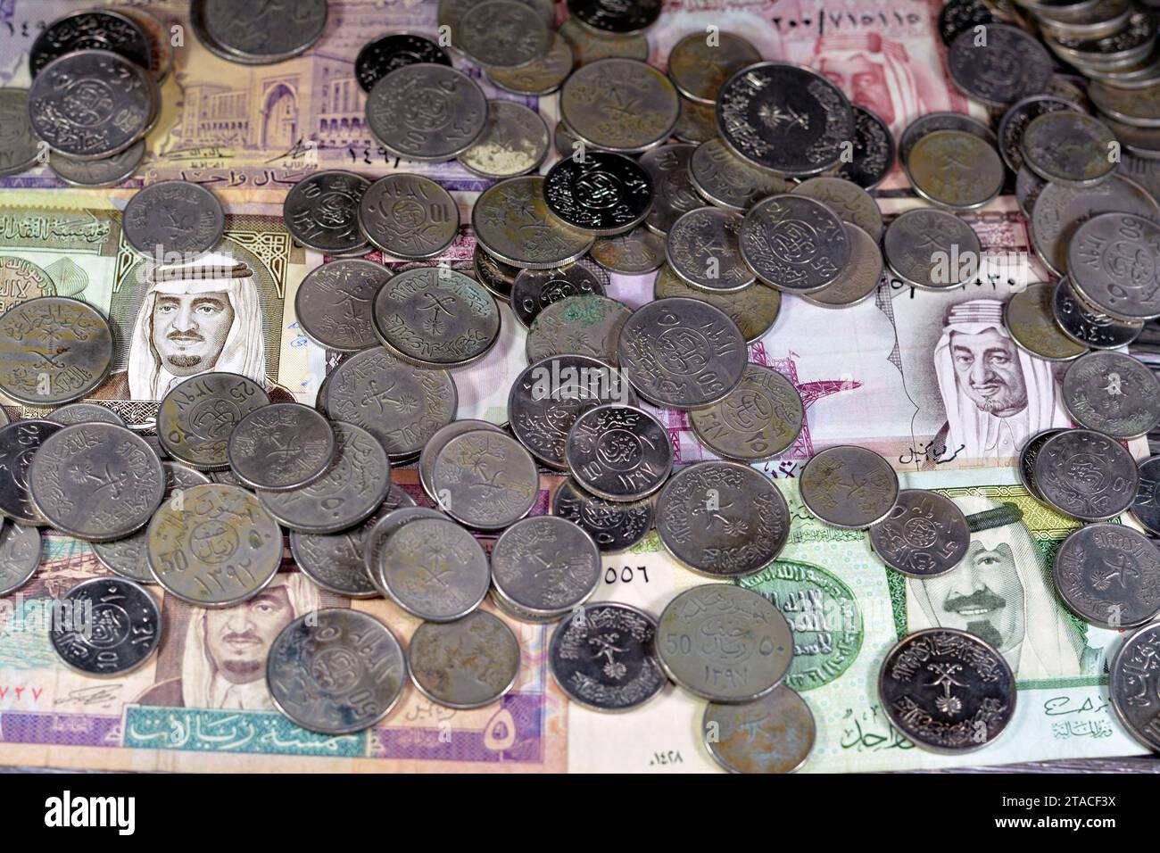 Saudi Arabia riyals money banknote bills and coins of different eras ...