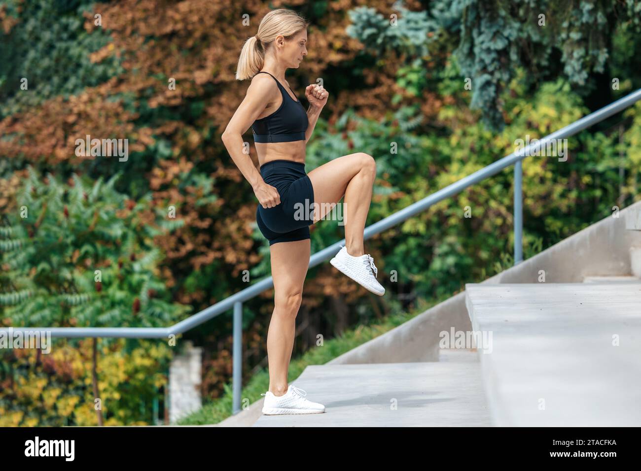 Athletic woman doing cardio training on stairs for burning fat Stock ...