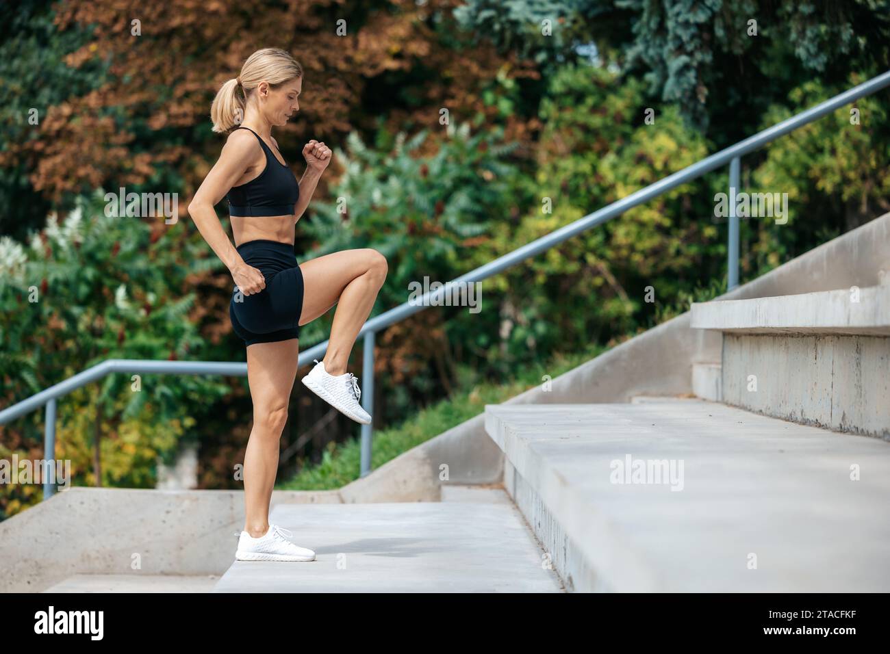 Athletic woman doing cardio training on stairs for burning fat Stock ...