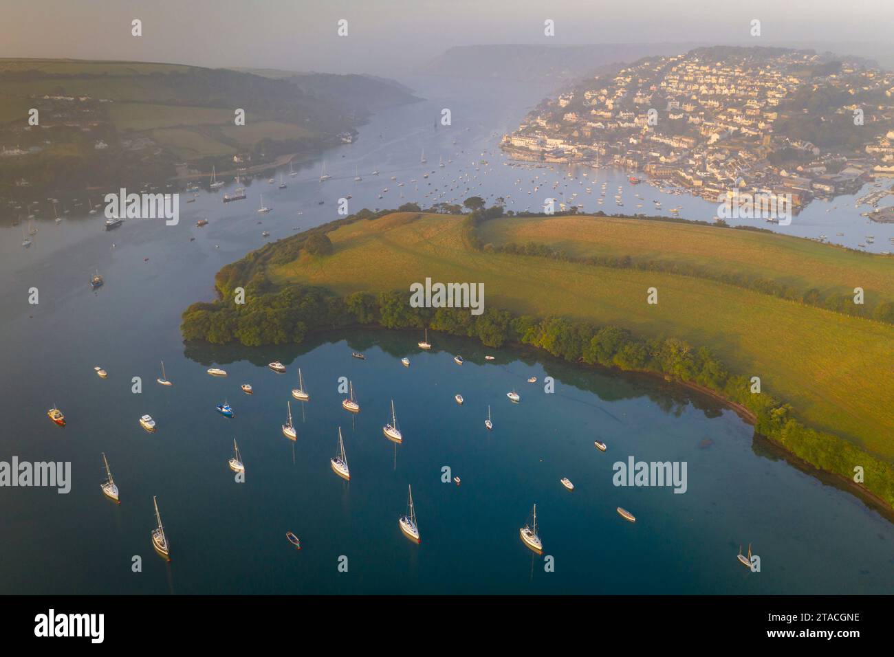 Aerial view of Salcombe and the Kingsbridge Estuary at dawn on a misty ...