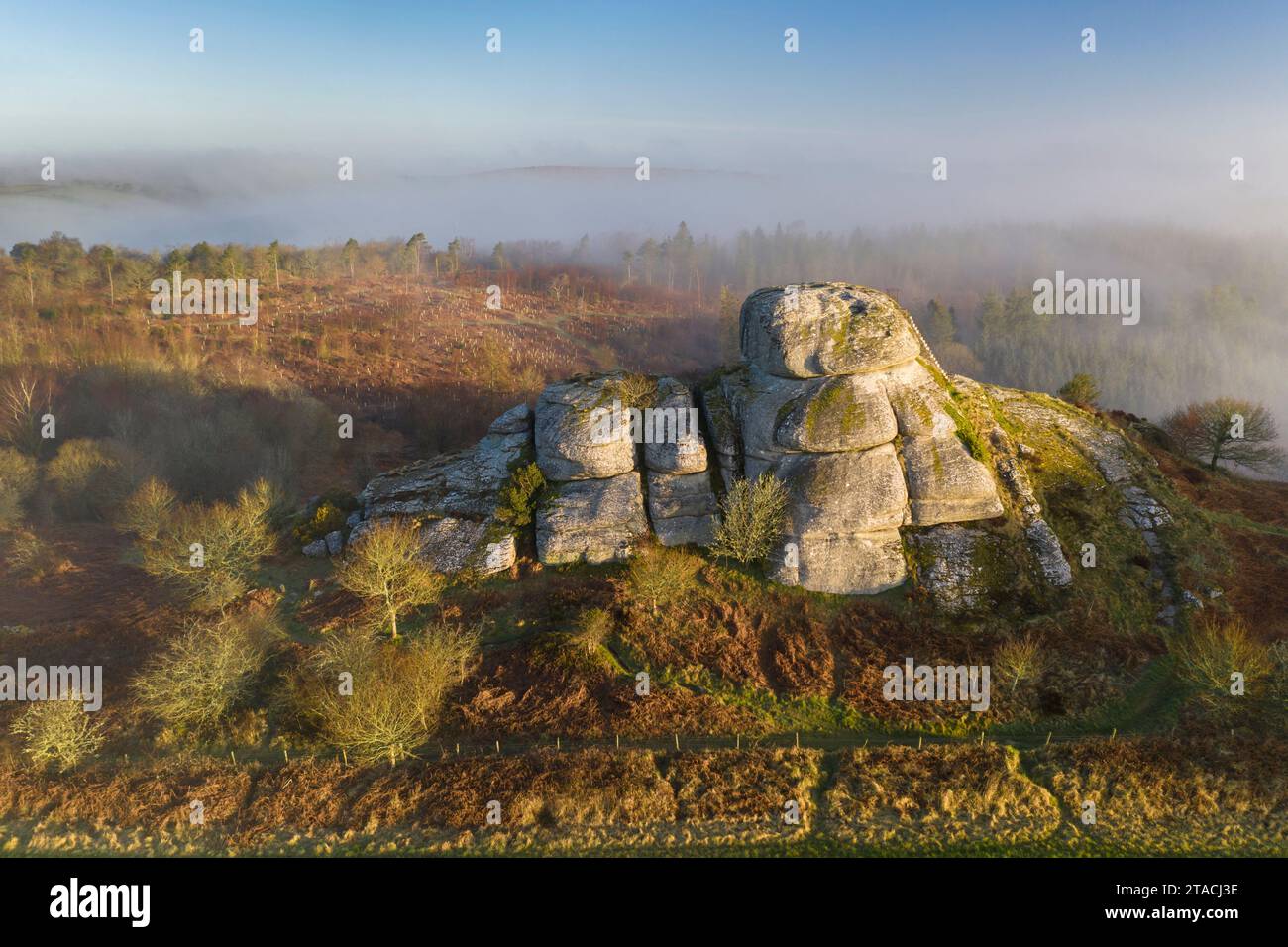 Aerial view of Blackingstone Rock on a misty winter morning, Dartmoor ...