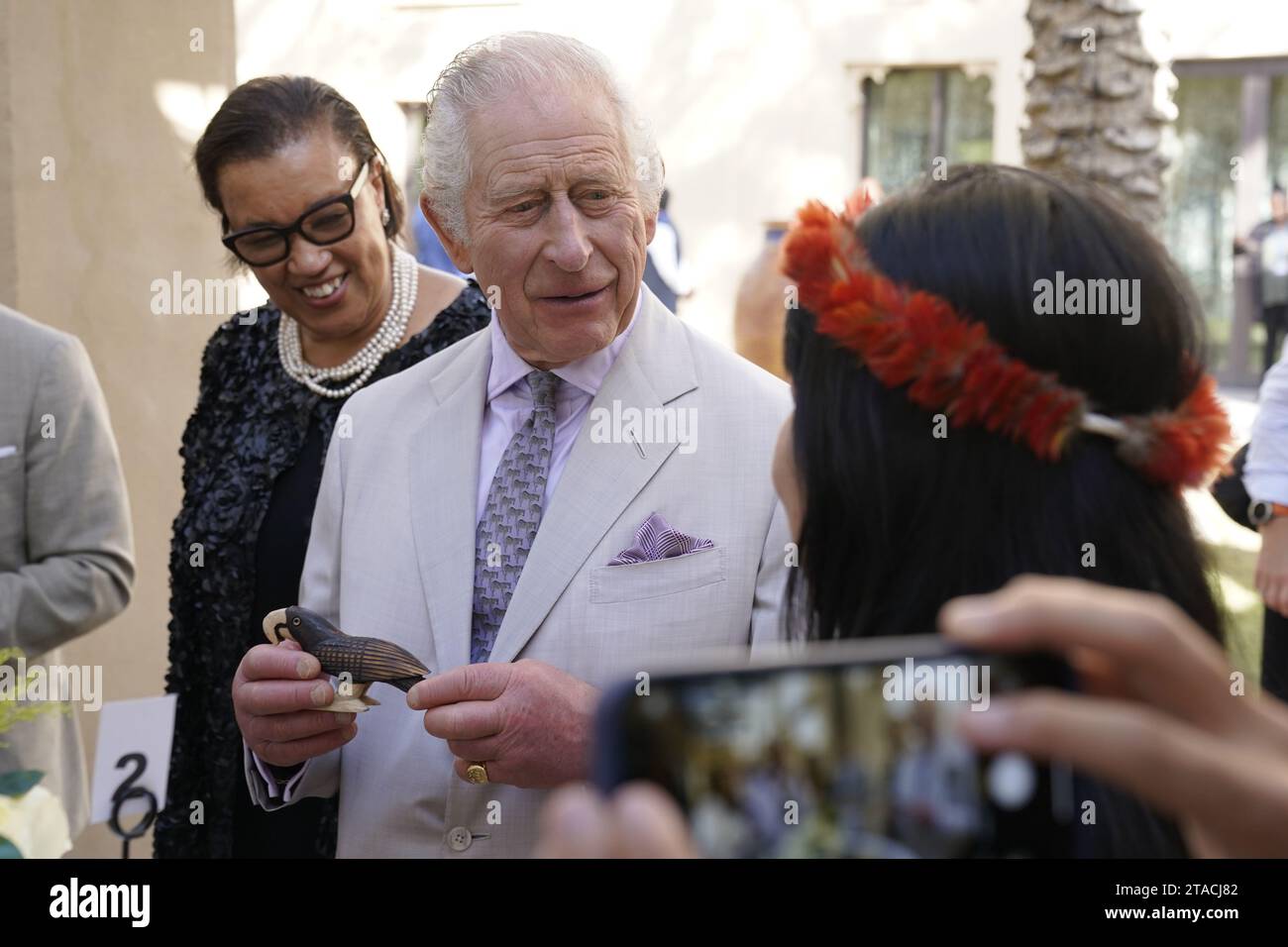 King Charles III is presented with a gift as he attends a Commonwealth ...