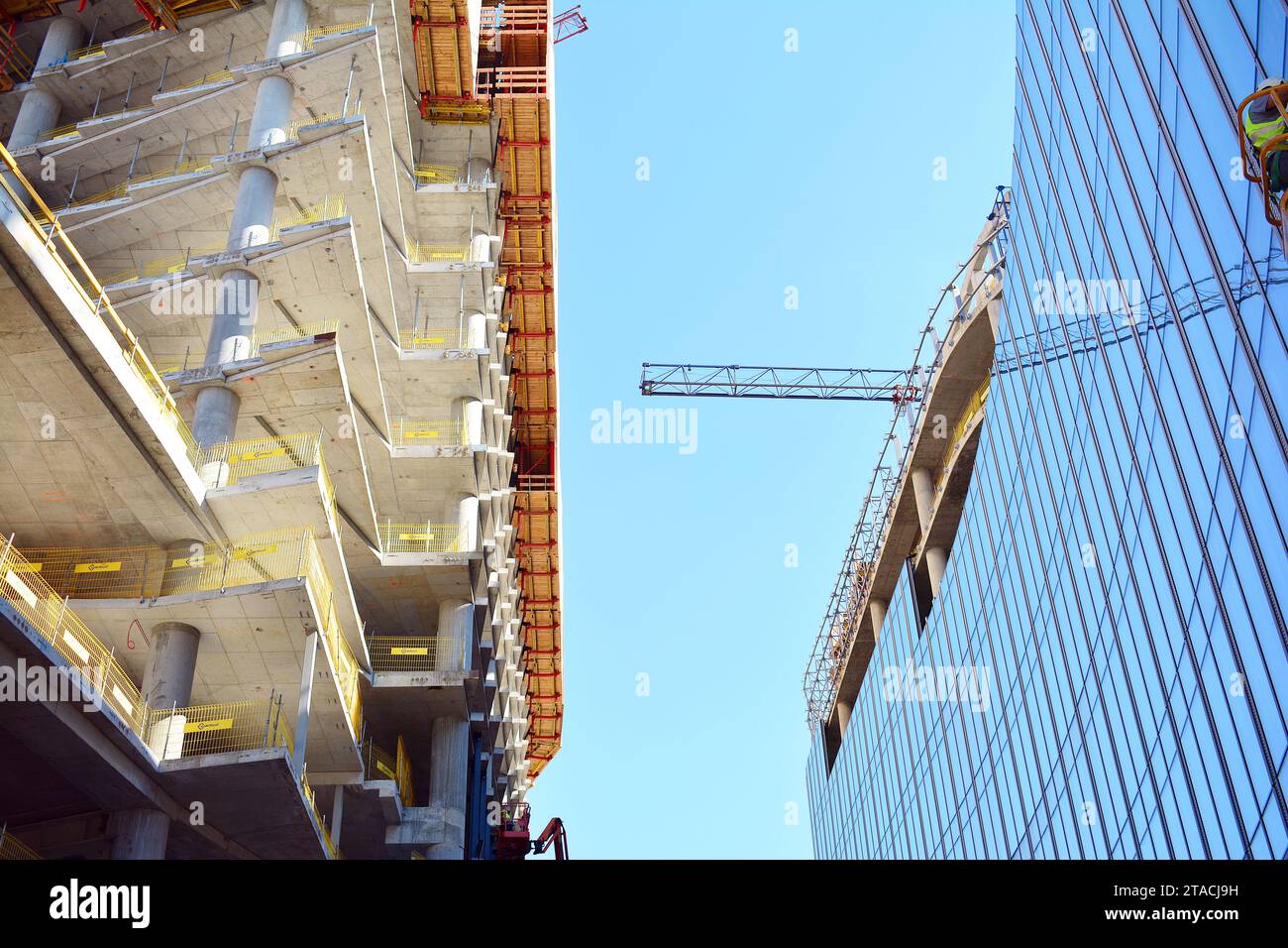 High rise building under construction. Installation of glass facade ...