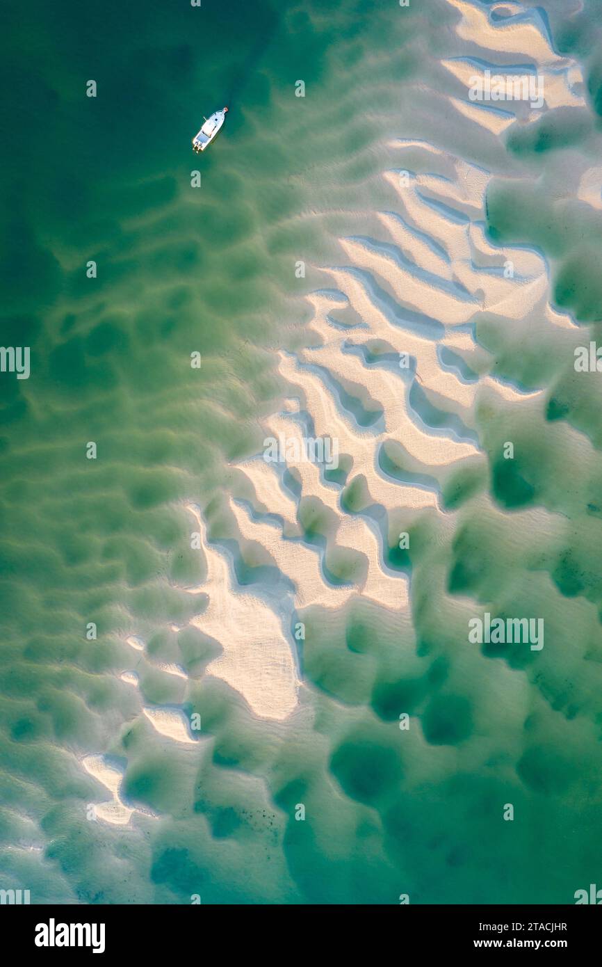 Aerial view of a boat moored on the Camel Estuary at low tide, Rock ...