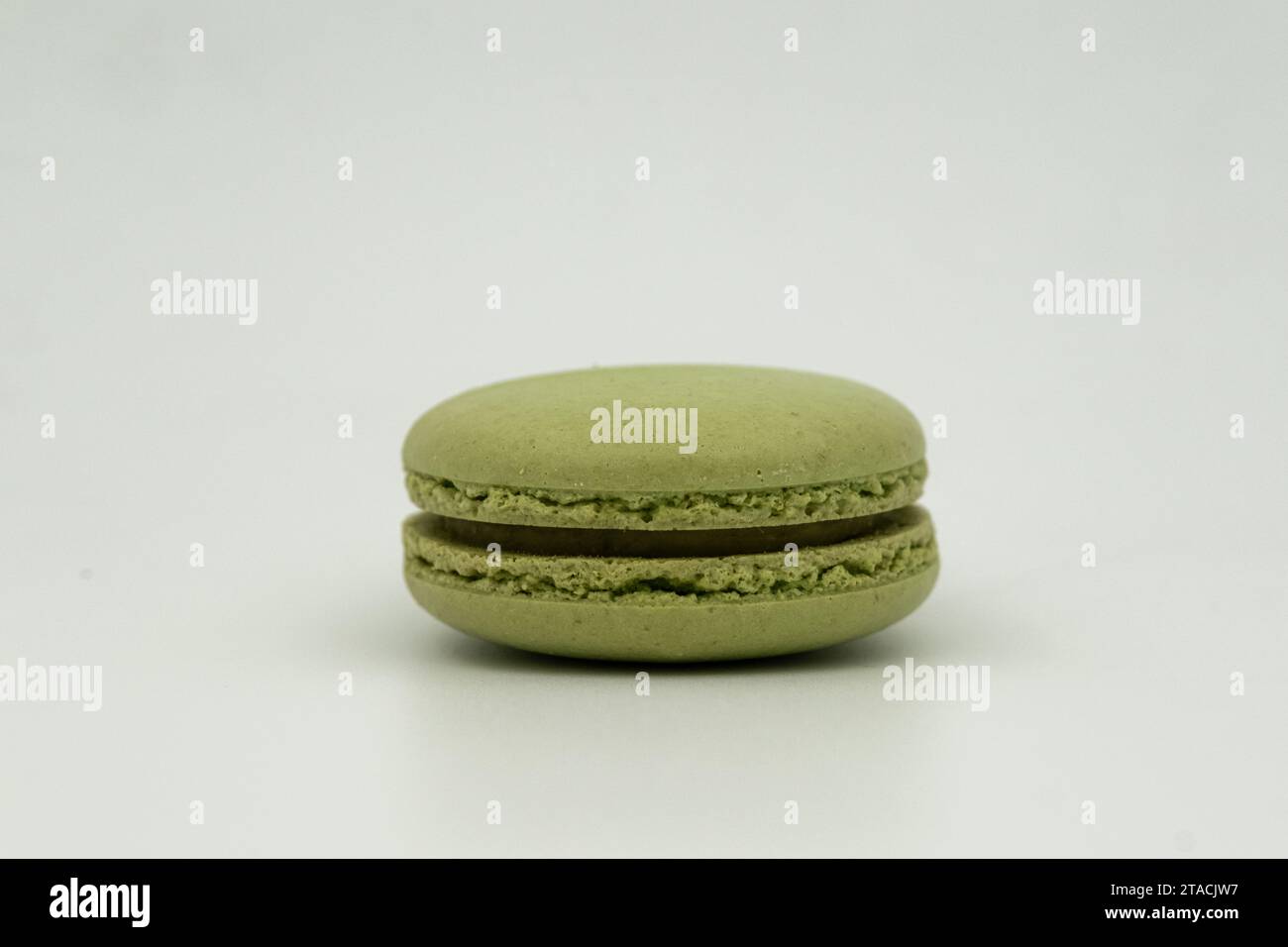 Green color macaron with pillow in front of a white background Stock ...
