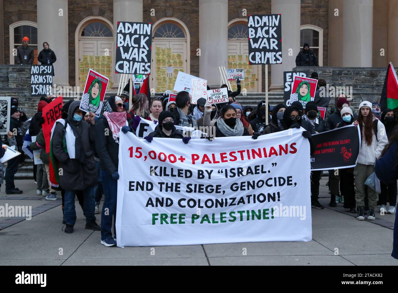 State College, United States. 29th Nov, 2023. Demonstrators hold ...