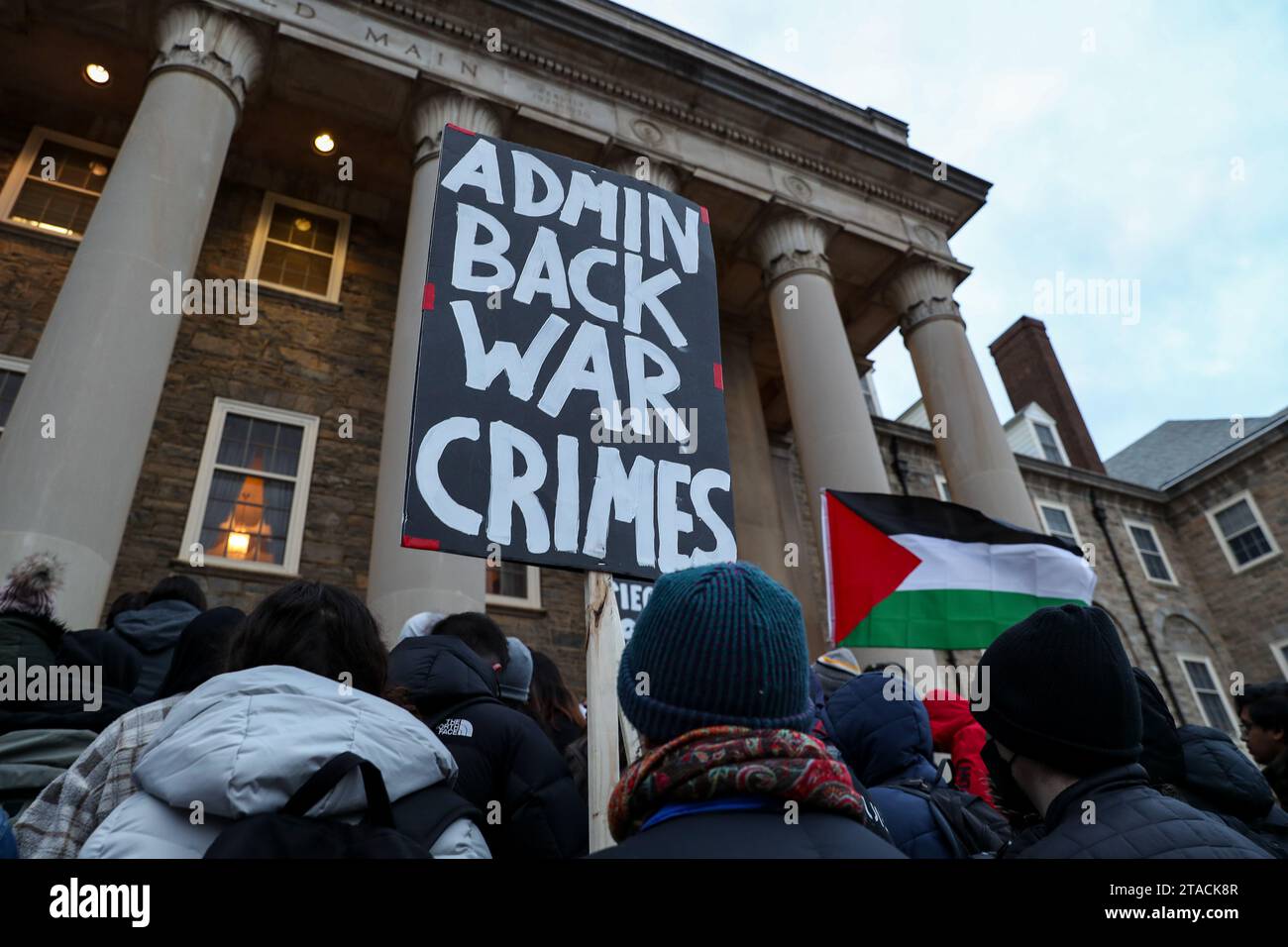 State College, United States. 29th Nov, 2023. Demonstrators hold ...