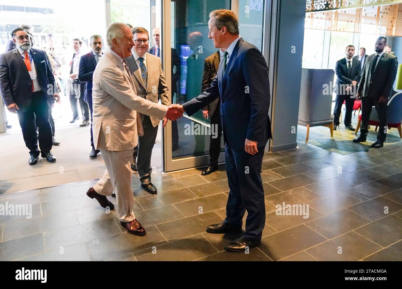 King Charles III is greeted by Foreign Secretary Lord David Cameron as ...