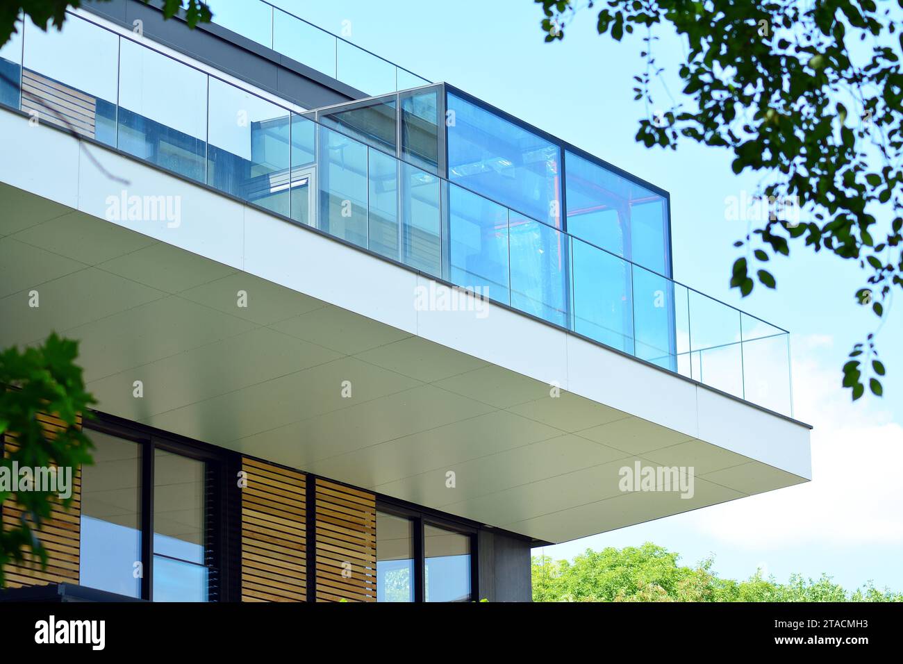 New apartment building with glass balconies. Modern architecture houses ...