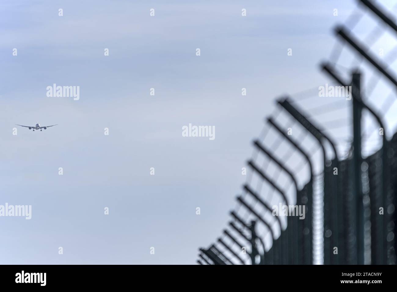 A plane approaching the airport to land on a runway whose perimeter is ...