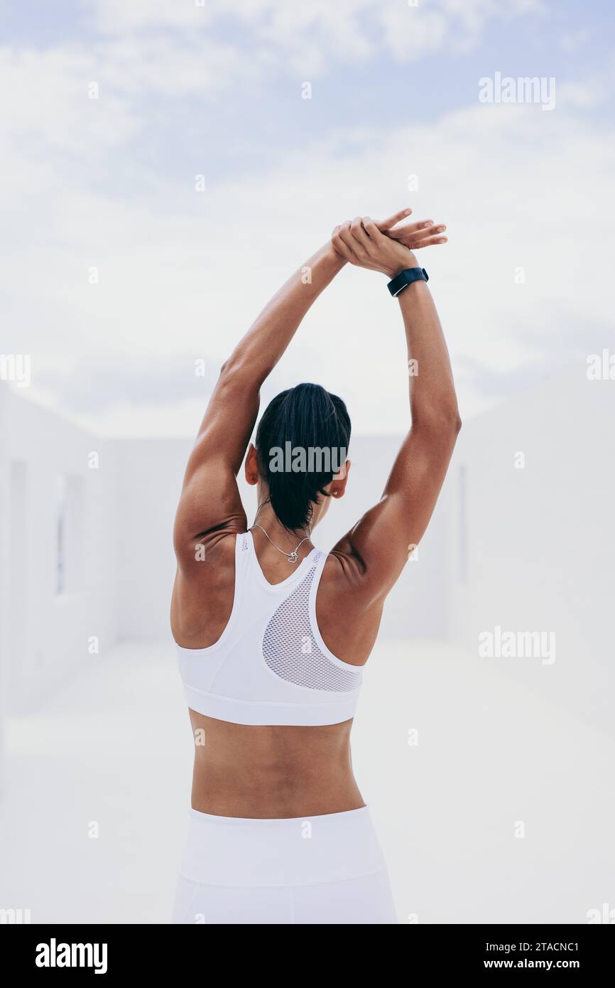 Woman stretching arms above head hi-res stock photography and images - Alamy