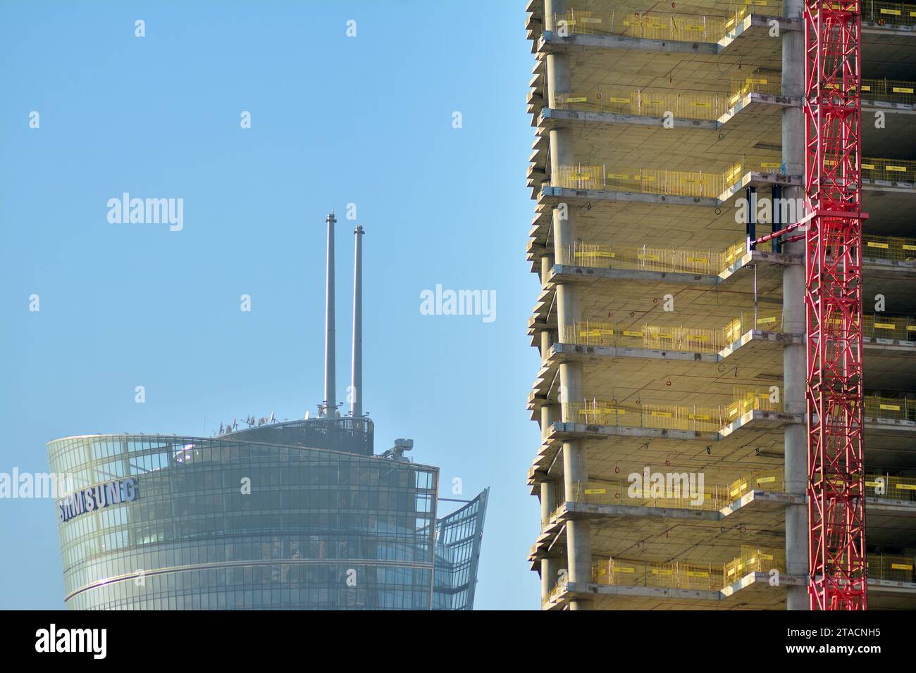 High rise building under construction. Installation of glass facade ...