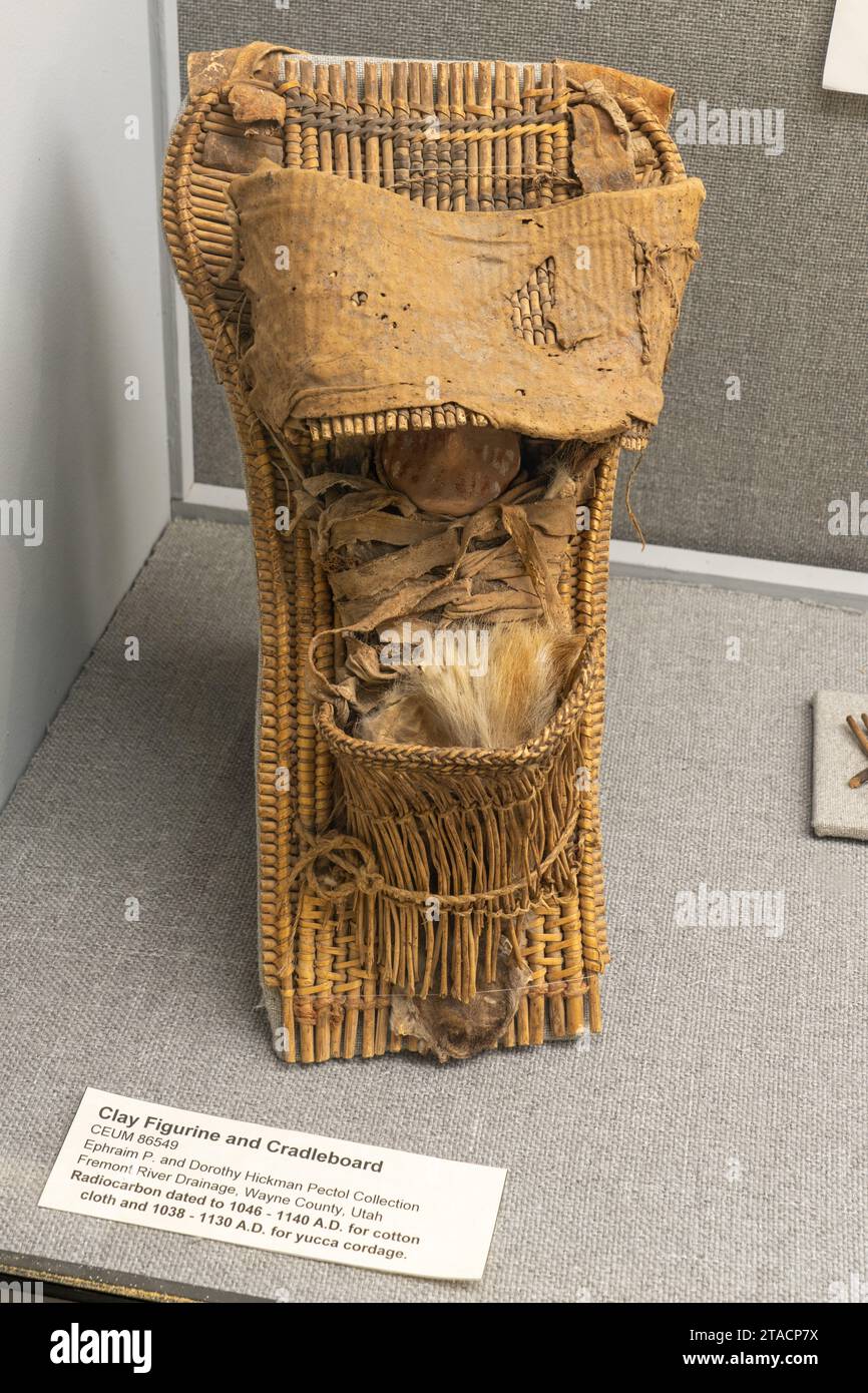 A Fremont culture cradleboard or papoose board with a clay figurine in ...