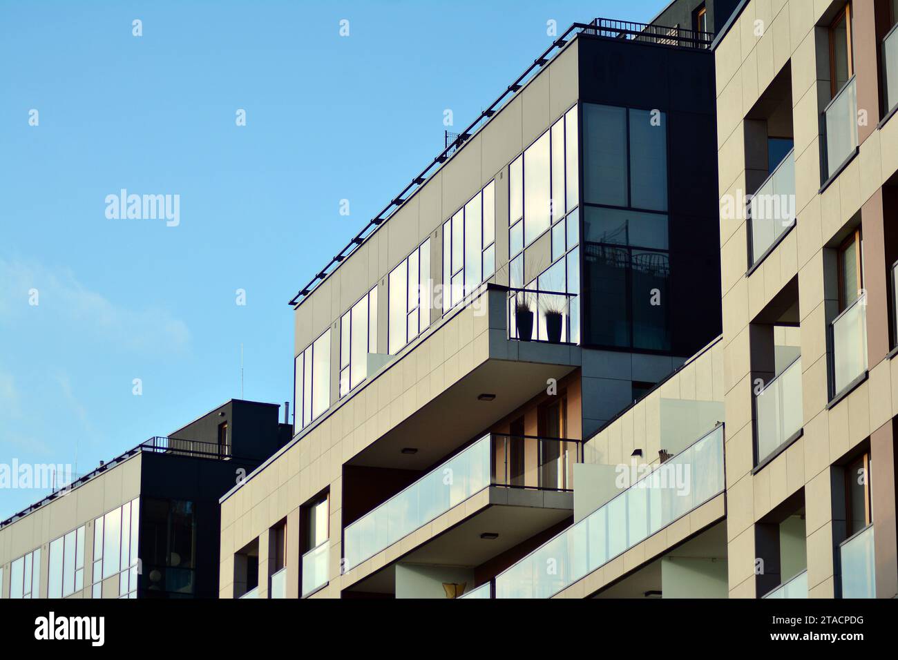 New apartment building with glass balconies. Modern architecture houses ...