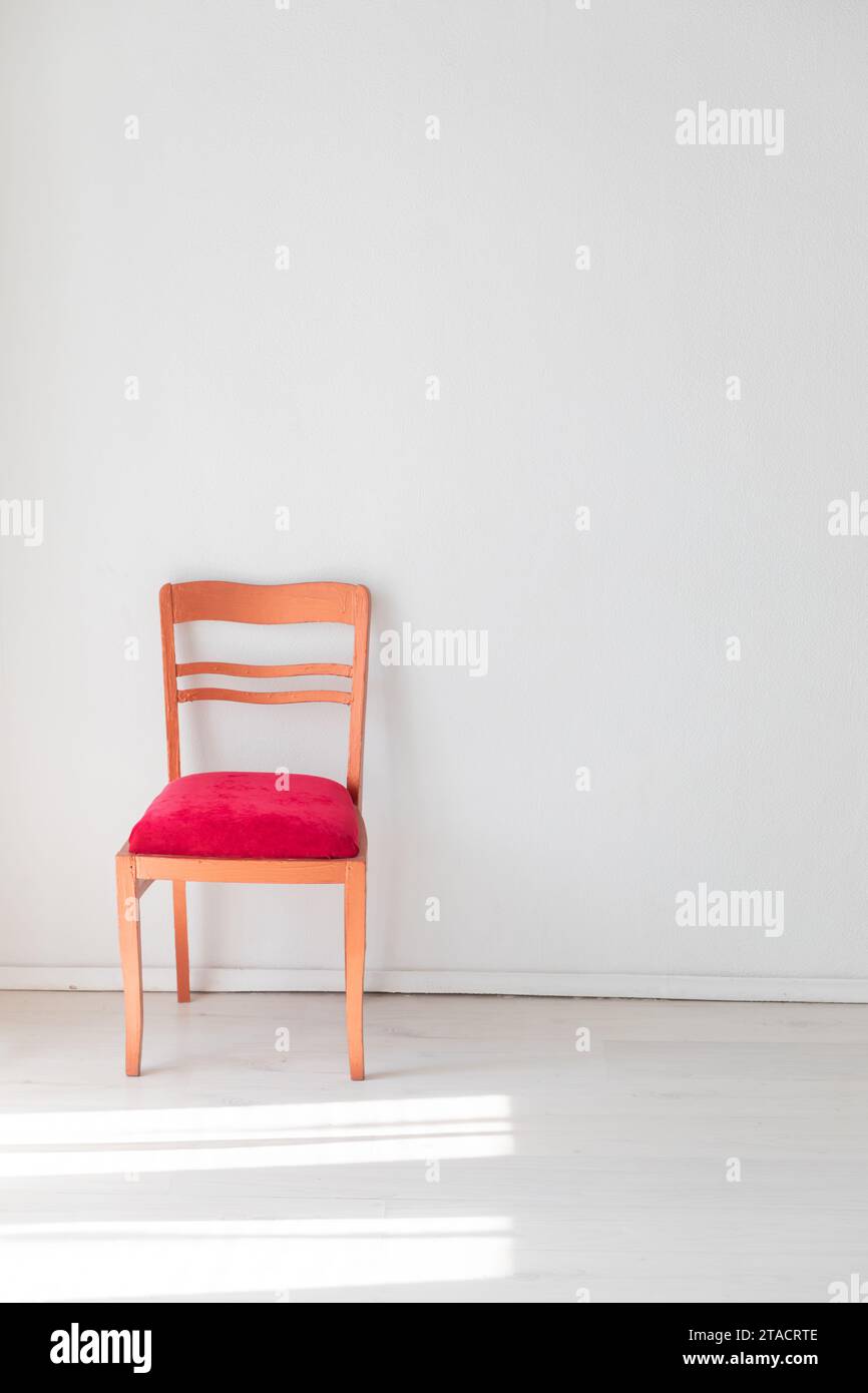red vintage chair in white room interior Stock Photo - Alamy