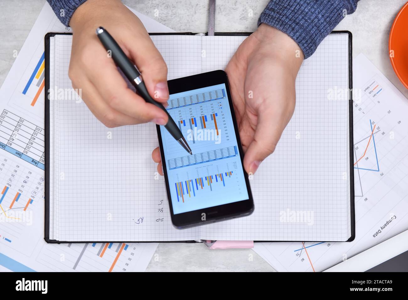 Businessman hands using smart phone with financial document. Money and ...