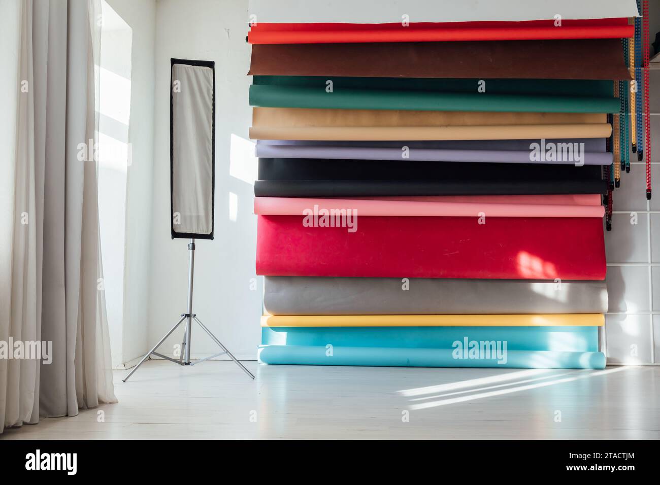Lots of paper colorful backgrounds in white photo studio Stock Photo ...