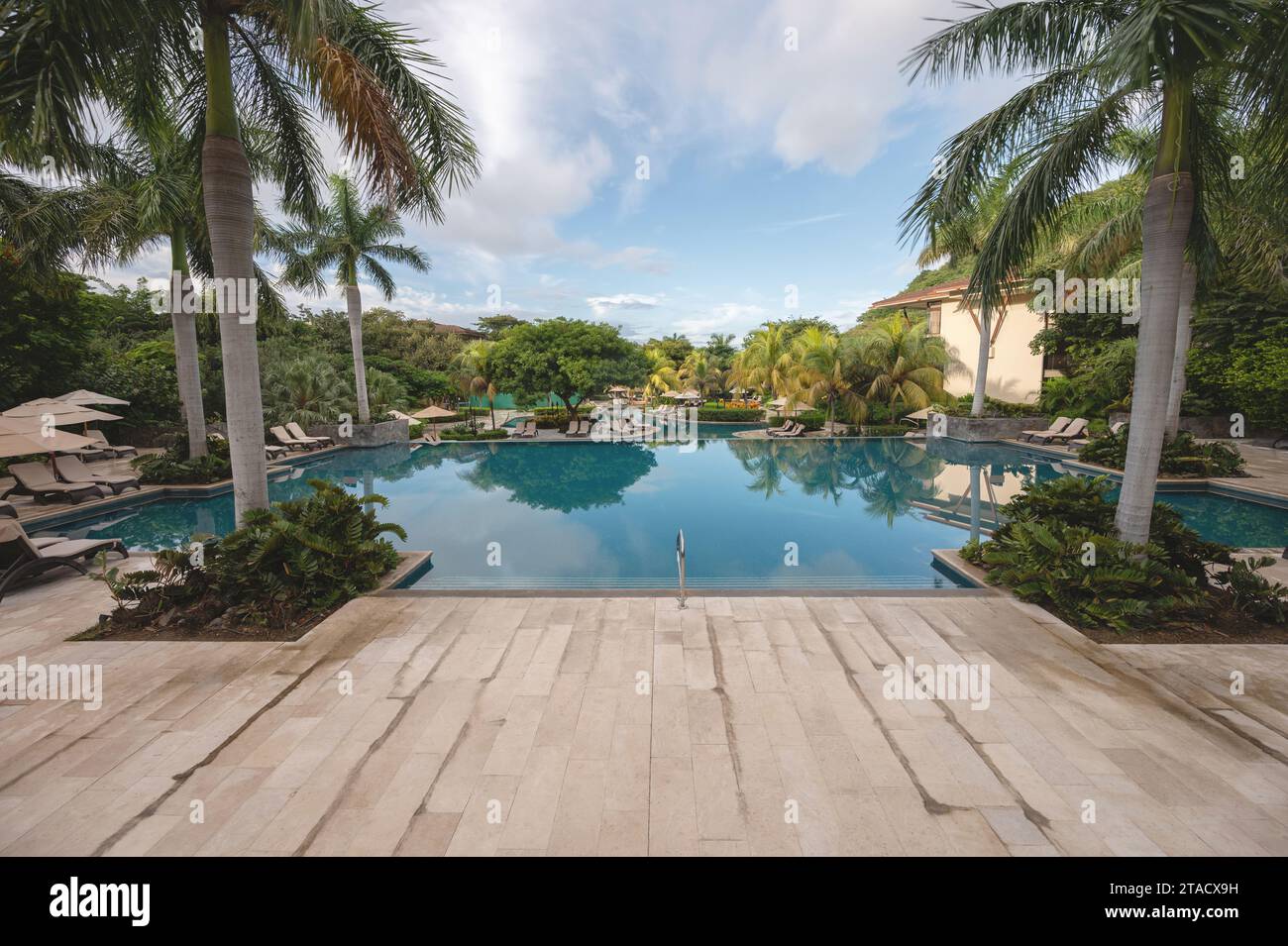 Tropical resort big blue pool hi-res stock photography and images - Alamy