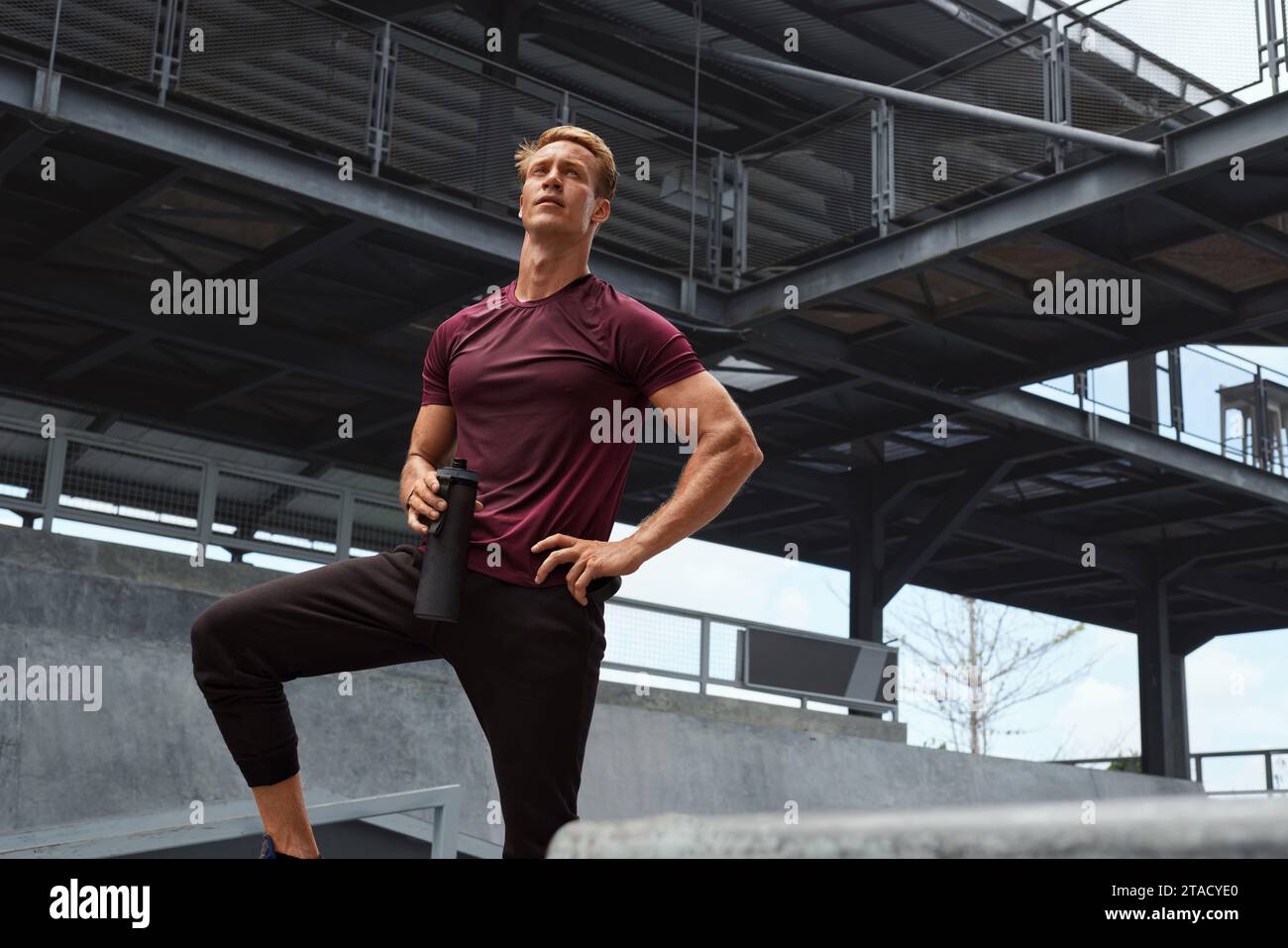 Young Man In Sweaty Shirt Resting After Intense Workout Break Against ...