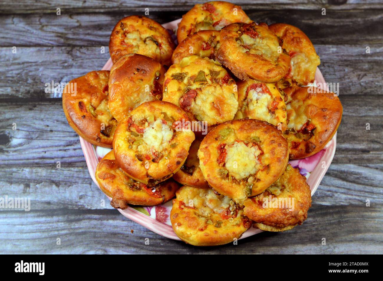 Pile of mini pizzas, Pizza is a dish of Italian origin consisting of a usually round, flat base ...