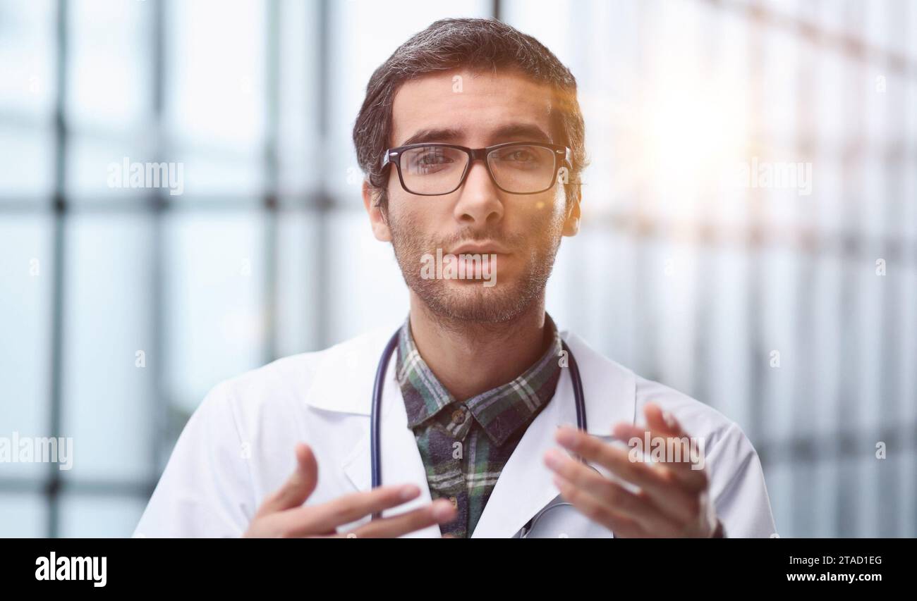 Head shot portrait male doctor talking online with patient, making ...