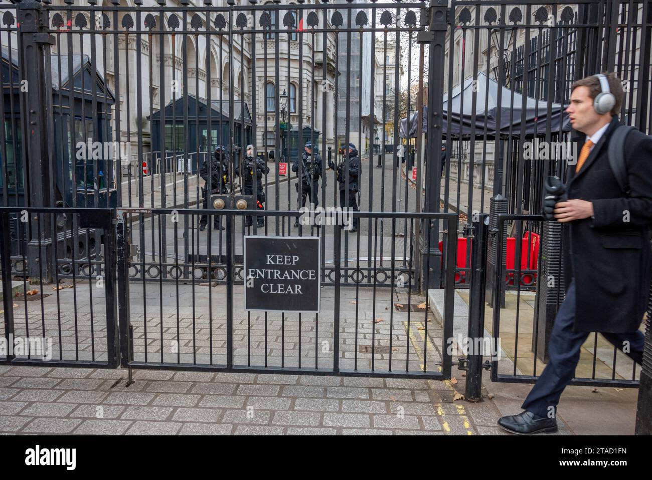 Security gates and armed security guards at the entrance to Downing ...