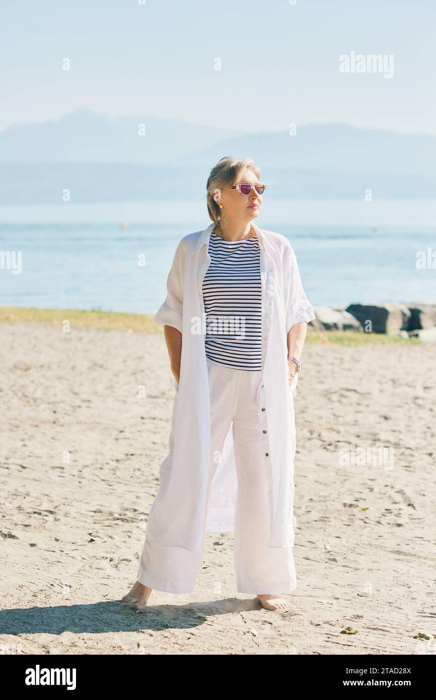 Outdoor summer portrait of happy and healthy mature 50 - 55 year old ...