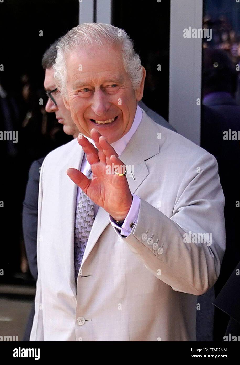 King Charles III waves to the crowds following a visit to the Heriot ...