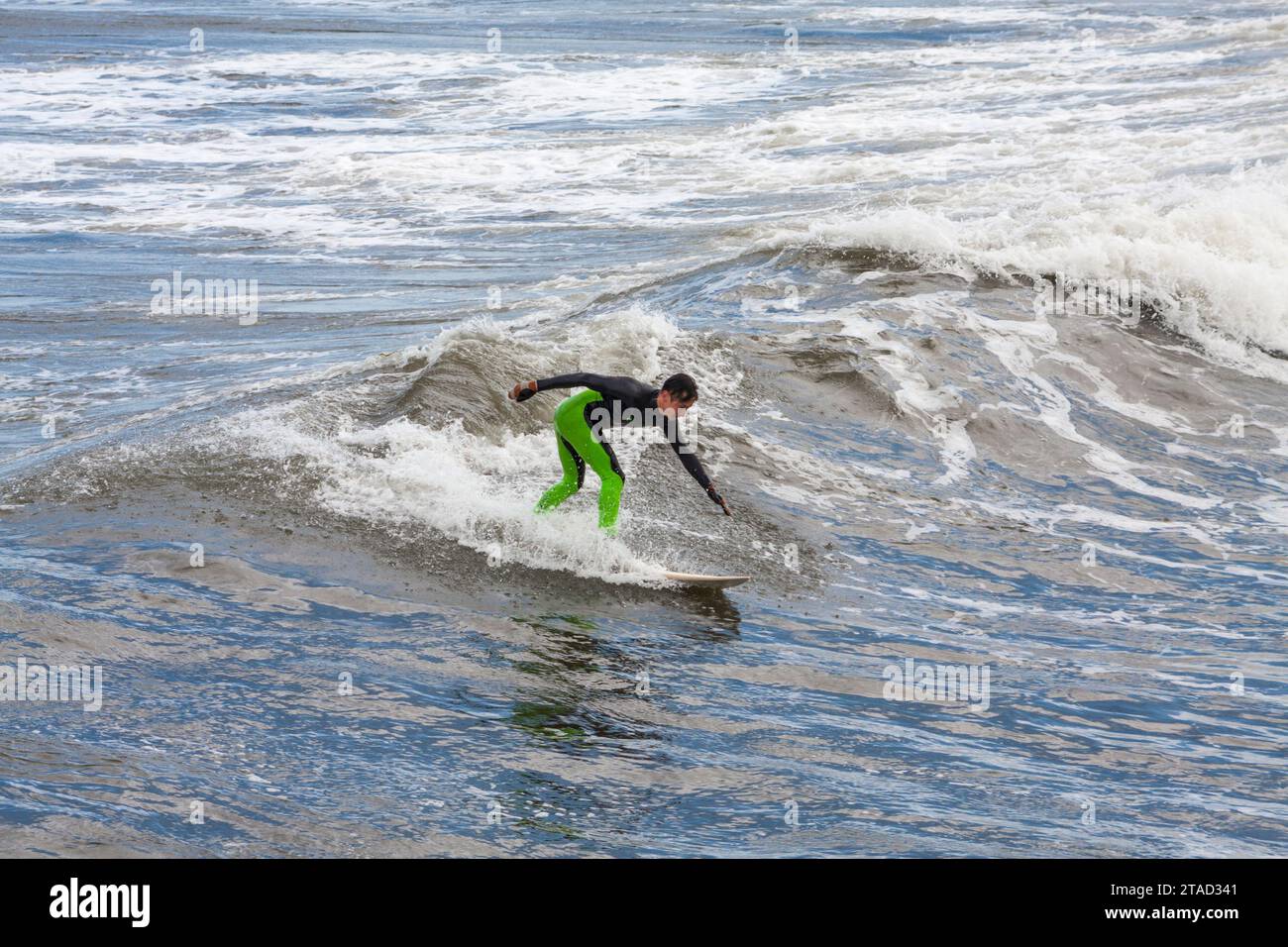 Surfer with black suit hi-res stock photography and images - Alamy