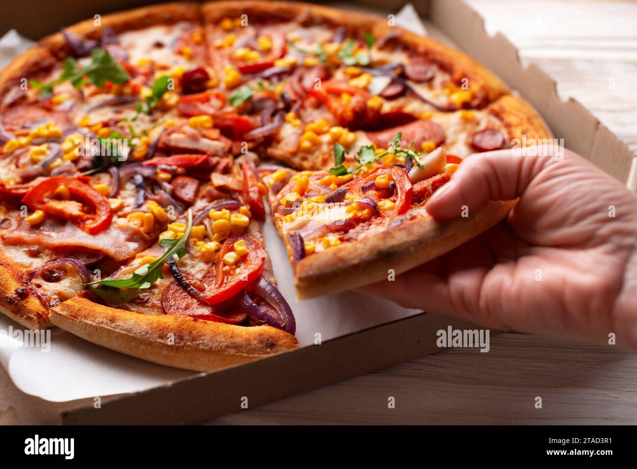 Pizza slice hand hi-res stock photography and images - Alamy