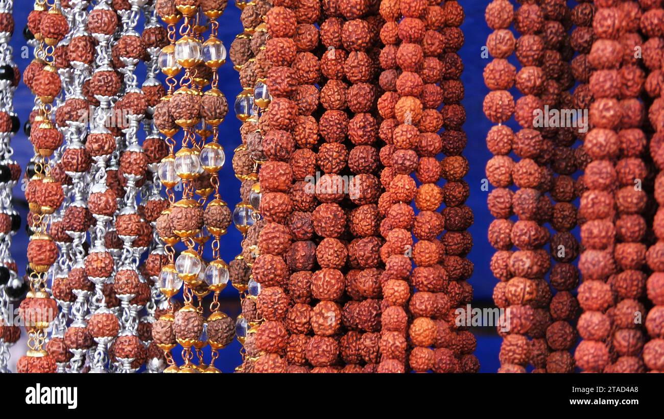 A collection of traditional prayer bead chains displayed in a shop ...