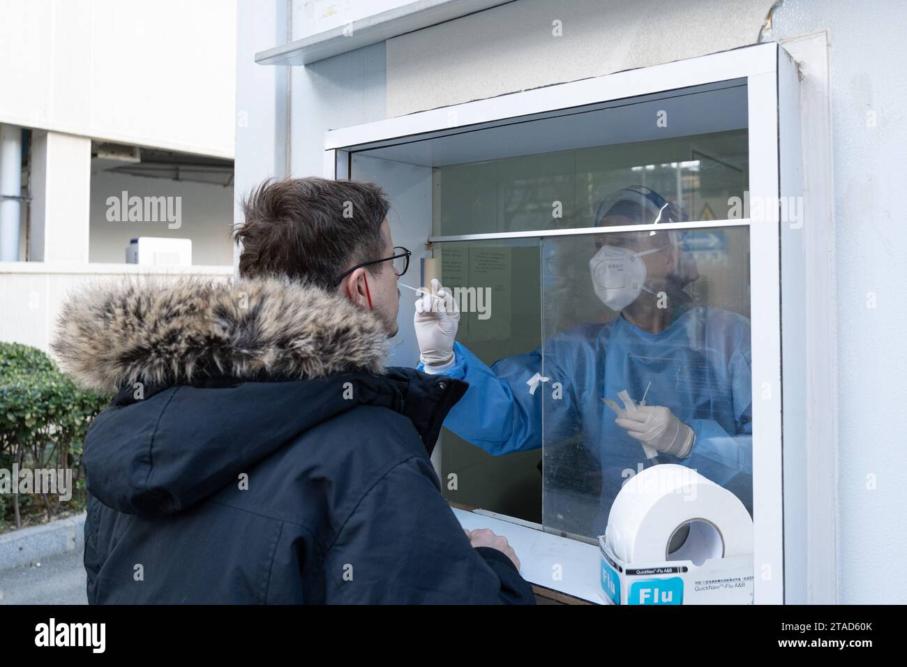 Man getting a nasal swab test for flu COVID in Beijing China Stock ...